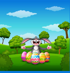 Cartoon rabbit laughing with five decorated easter