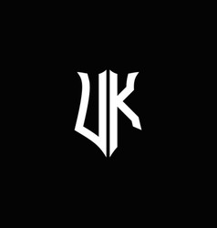 Uk logo monogram with gold colors and shield Vector Image