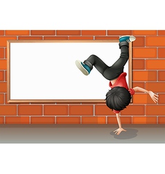 A boy breakdancing in front empty board Royalty Free Vector