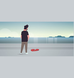 Pop art sad young man sitting on the beach Vector Image